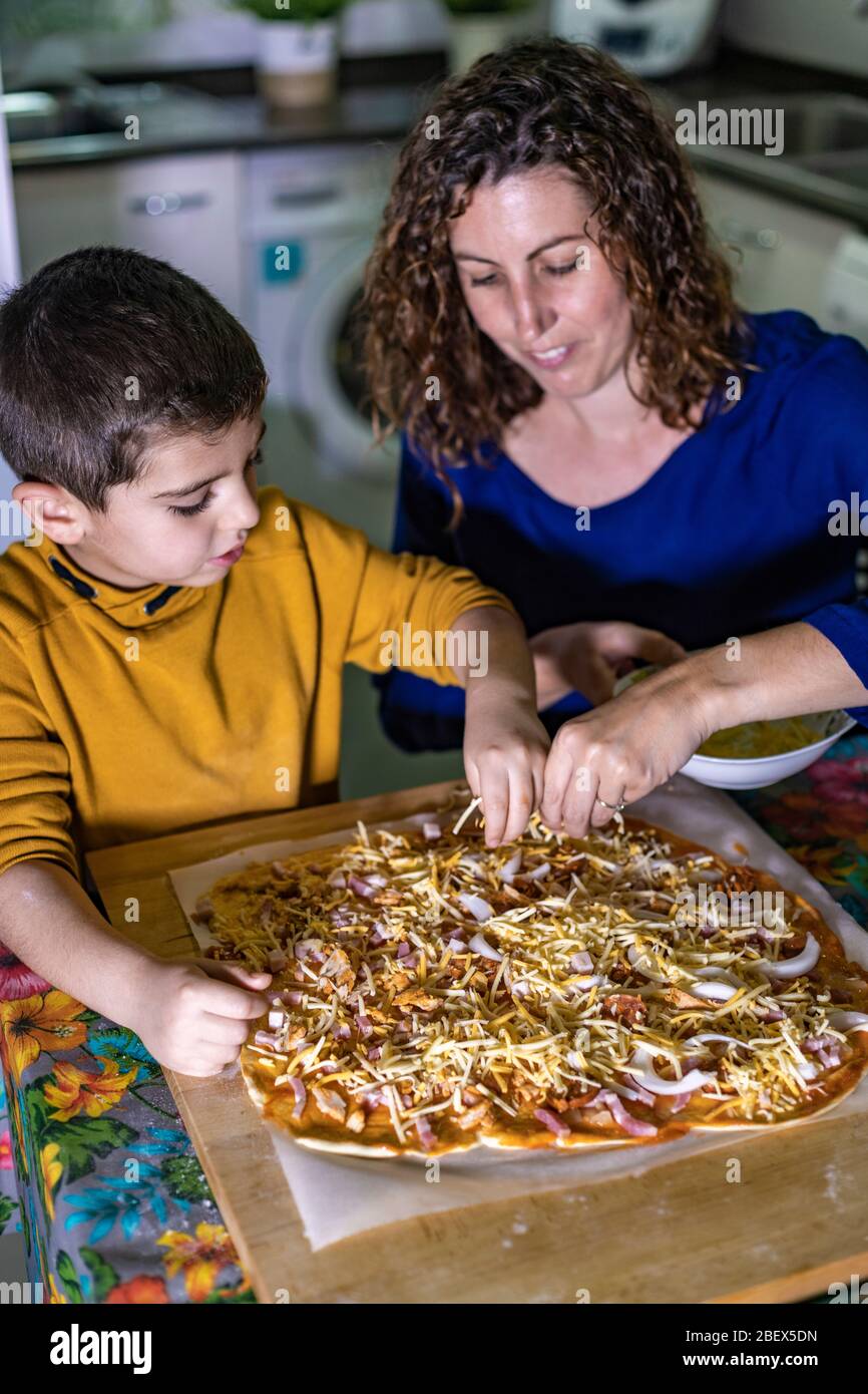 Mother and son making a homemade pizza Stock Photo - Alamy
