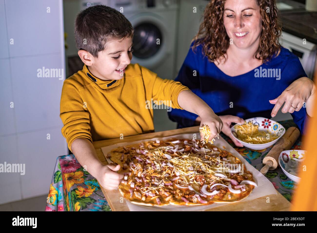 Mother and son making a homemade pizza Stock Photo - Alamy
