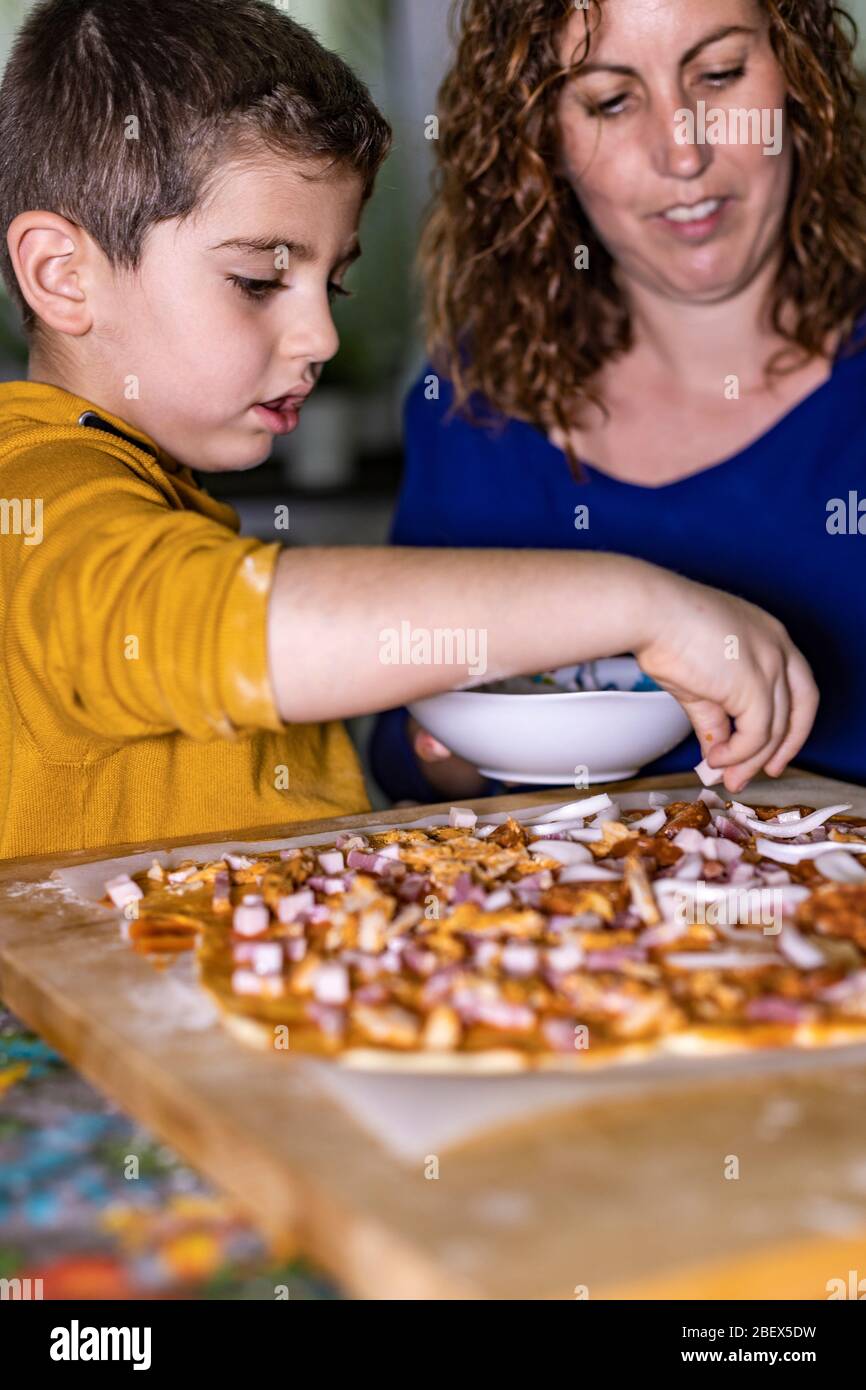 Mother and son making a homemade pizza Stock Photo - Alamy