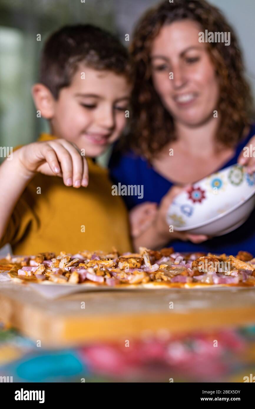 Mother and son making a homemade pizza Stock Photo - Alamy