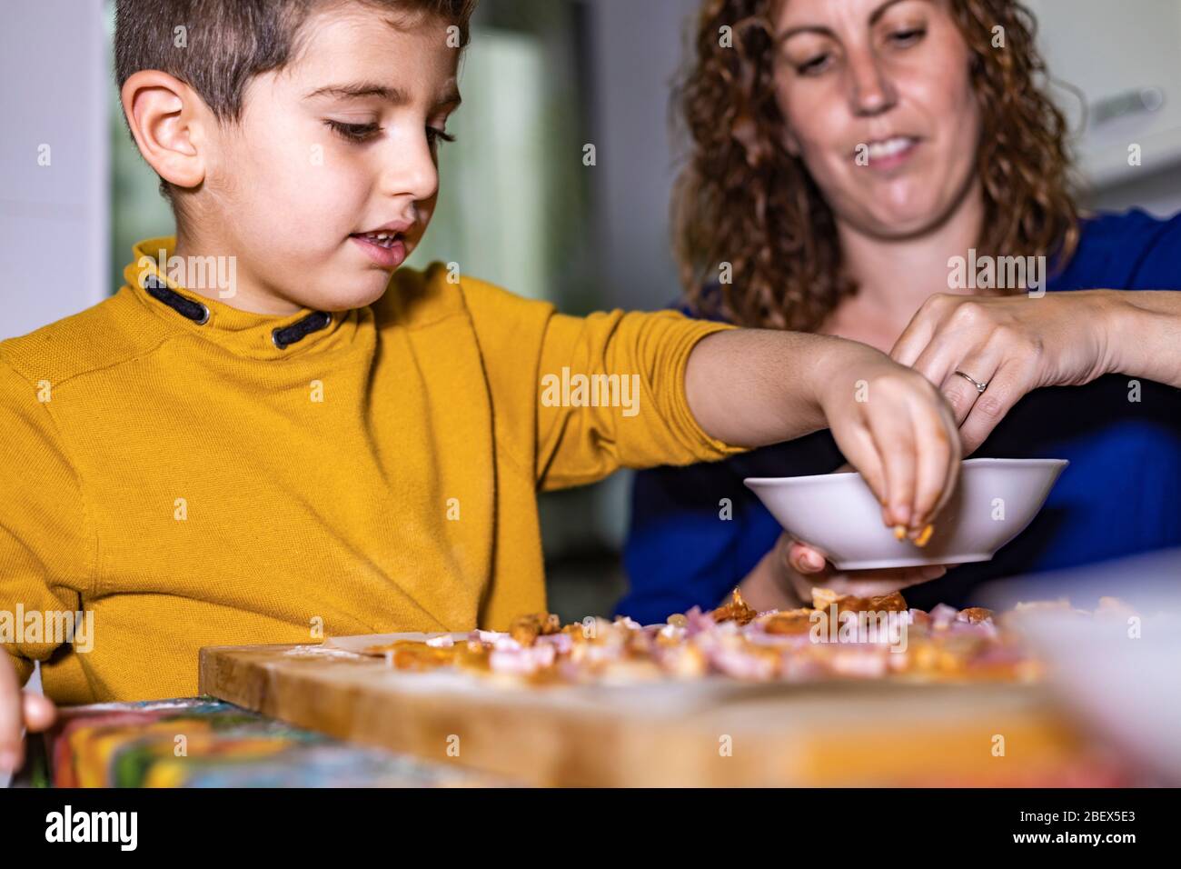 Mother and son making a homemade pizza Stock Photo - Alamy