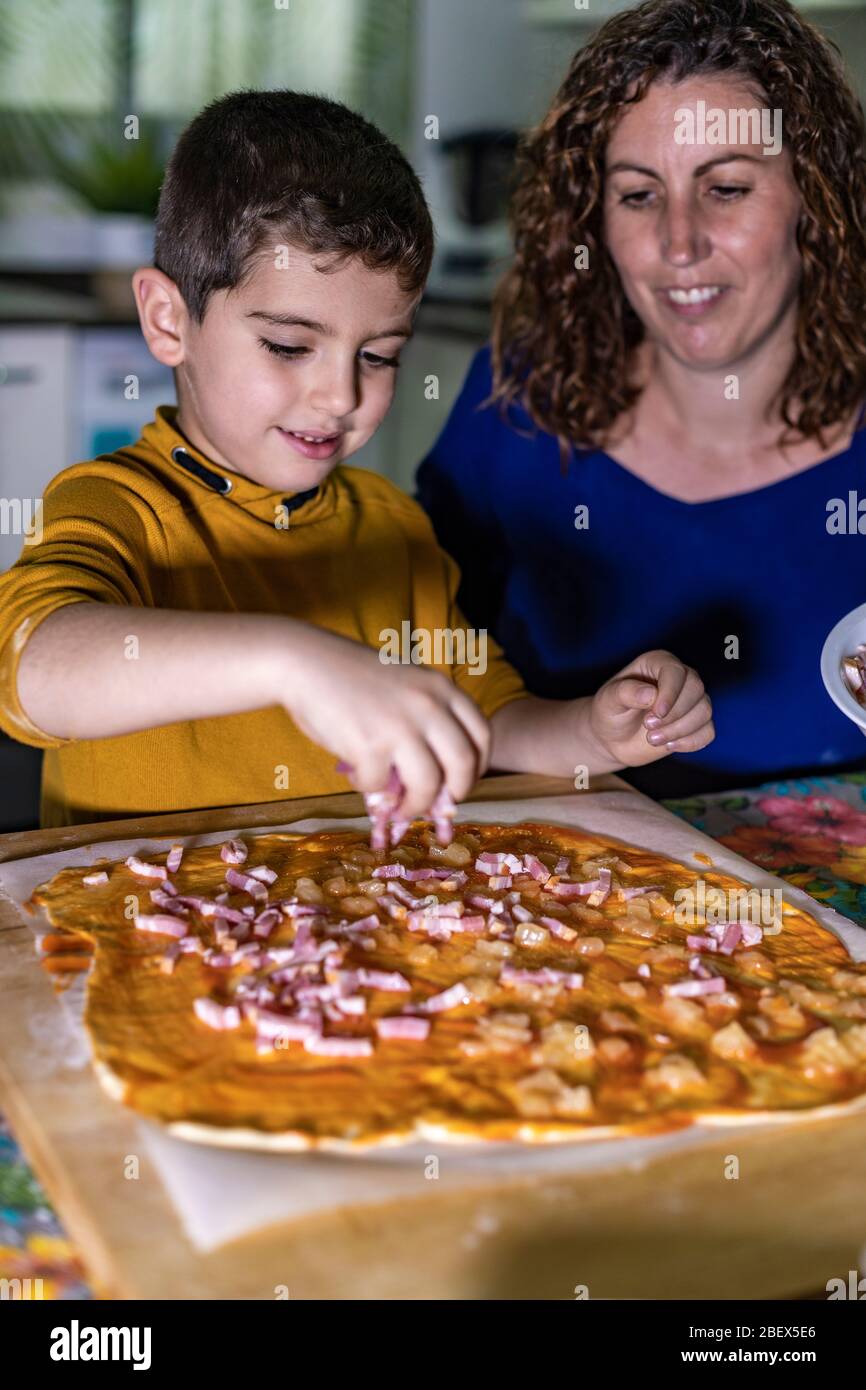 Mother and son making a homemade pizza Stock Photo - Alamy