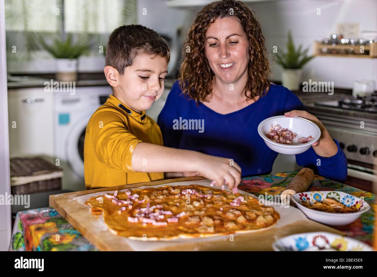 Mother and son making a homemade pizza Stock Photo - Alamy