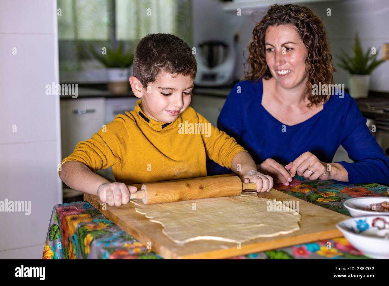 Mother and son making dough to make a pizza Stock Photo - Alamy