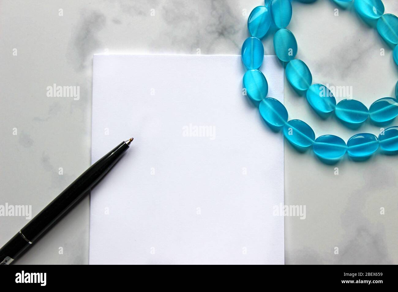 Marble background. Markers of blue shades and a sheet of paper. Sheet ...