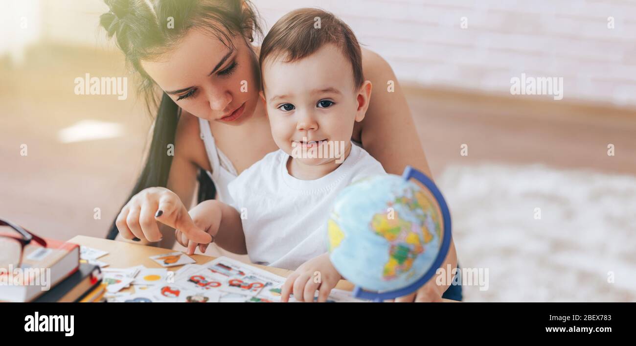 Teaching children with parents Stock Photo - Alamy