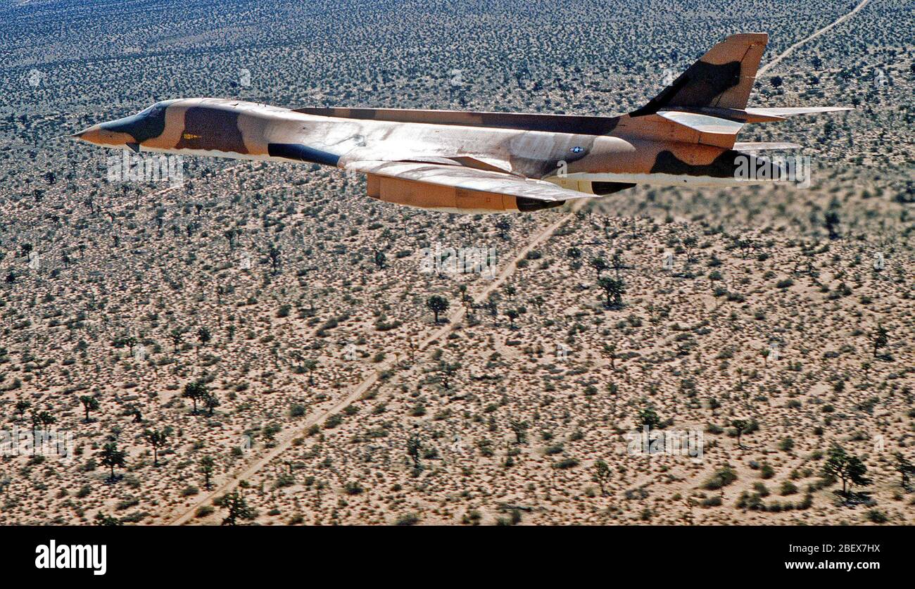 A left side view of a B-1 bomber aircraft over the base range during ...