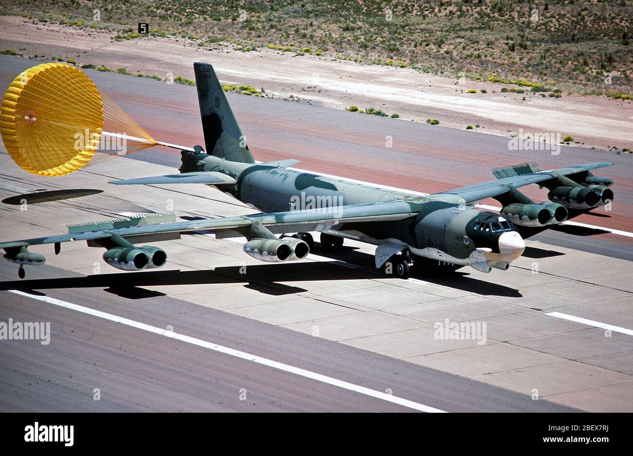 1981 - A B-52H Stratofortress aircraft lands with its rear drag chute ...