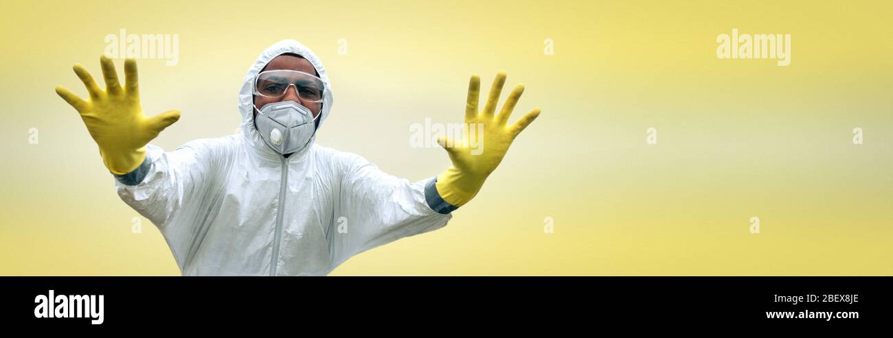 Man in protection suit prohibiting entry Stock Photo - Alamy