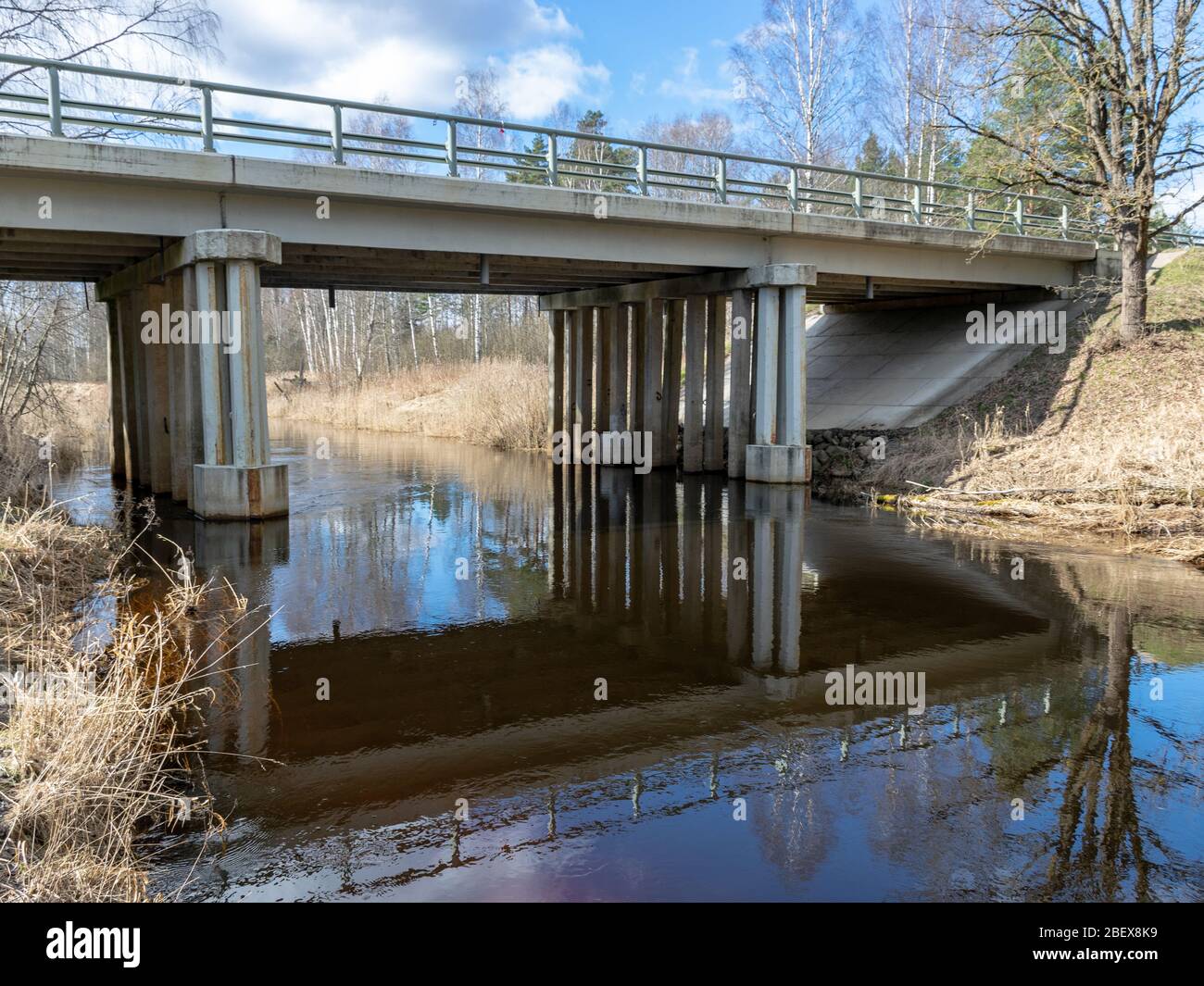 sunny spring landscape with a bridge over the river Seda, Latvia Stock ...