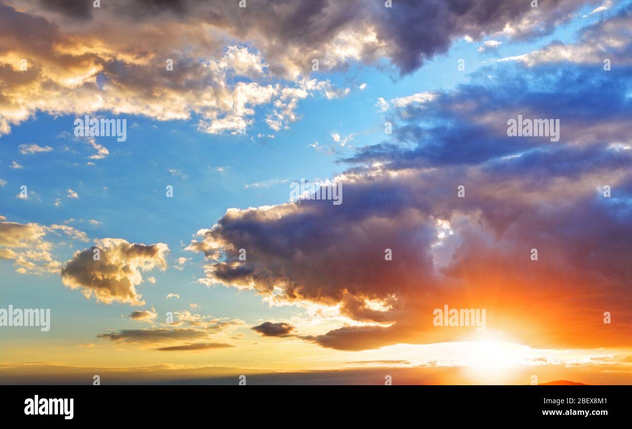 Sky background with sun Stock Photo - Alamy