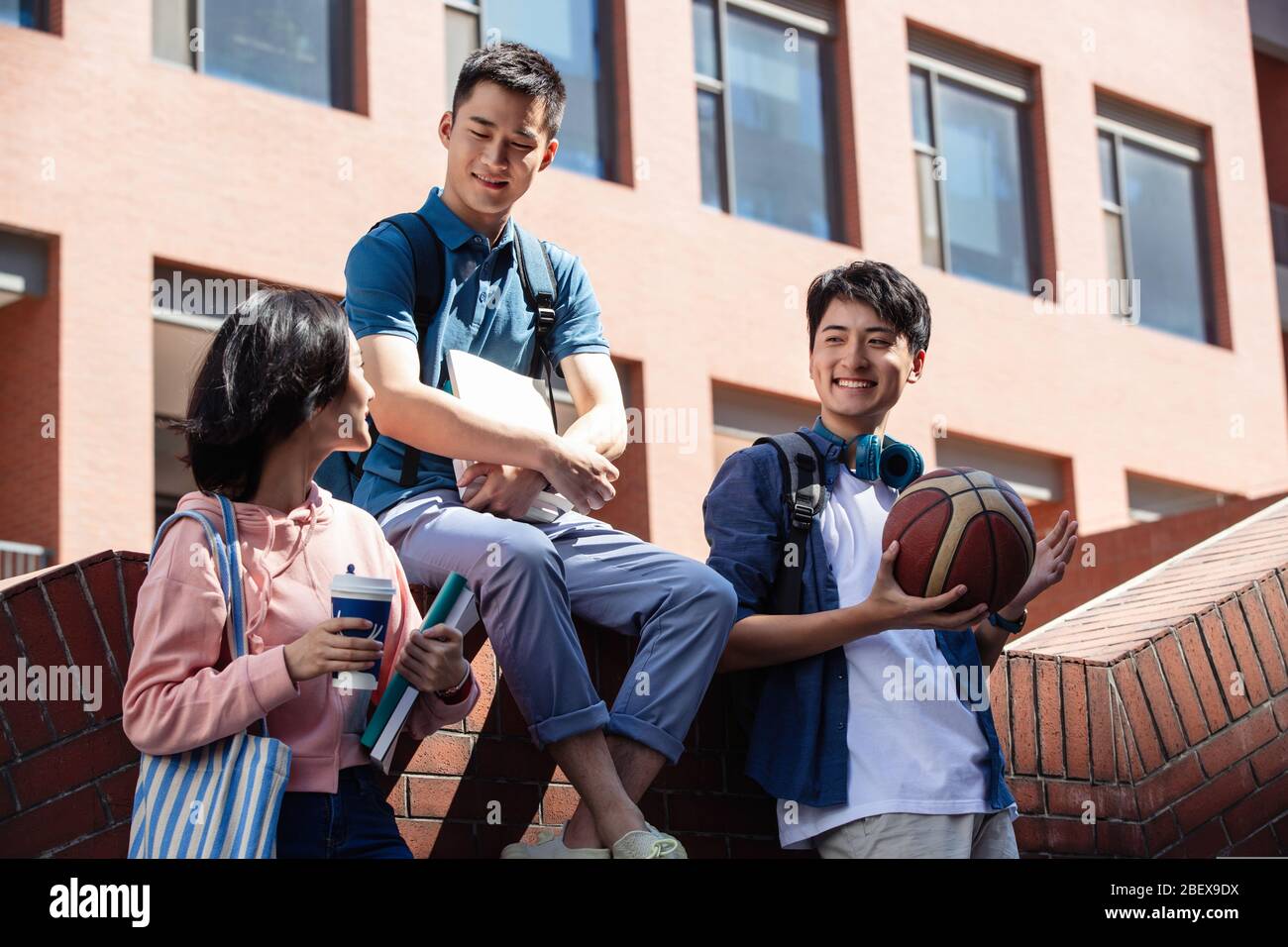 The first class of college students on campus gossip Stock Photo - Alamy