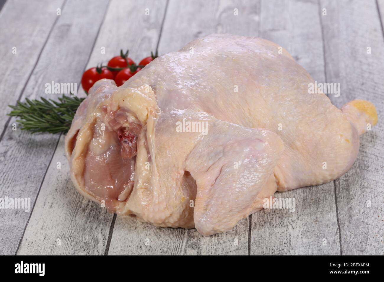 Raw chicken ready for cooking over wooden background Stock Photo - Alamy