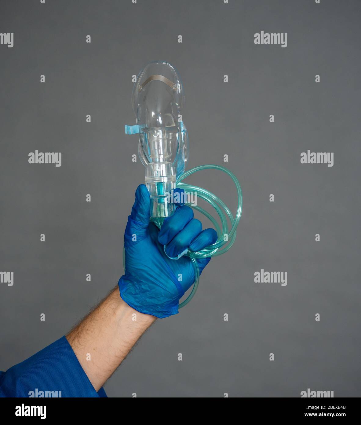 COVID-19 Outbreak. Exhausted Doctor holding non- invasive ventilator ...