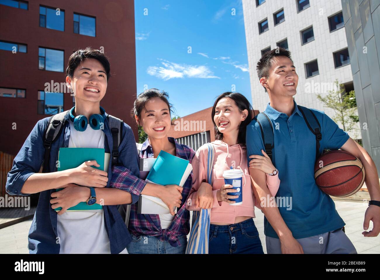 Two couples on the campus of university students Stock Photo - Alamy