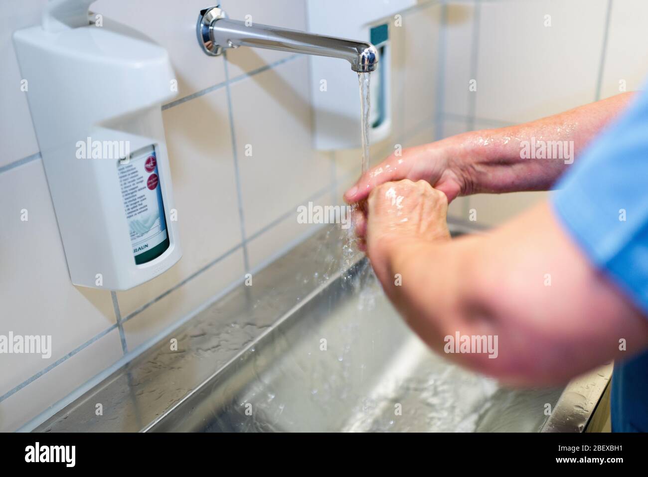 Medical professional washing hands before operation. Close up capture ...