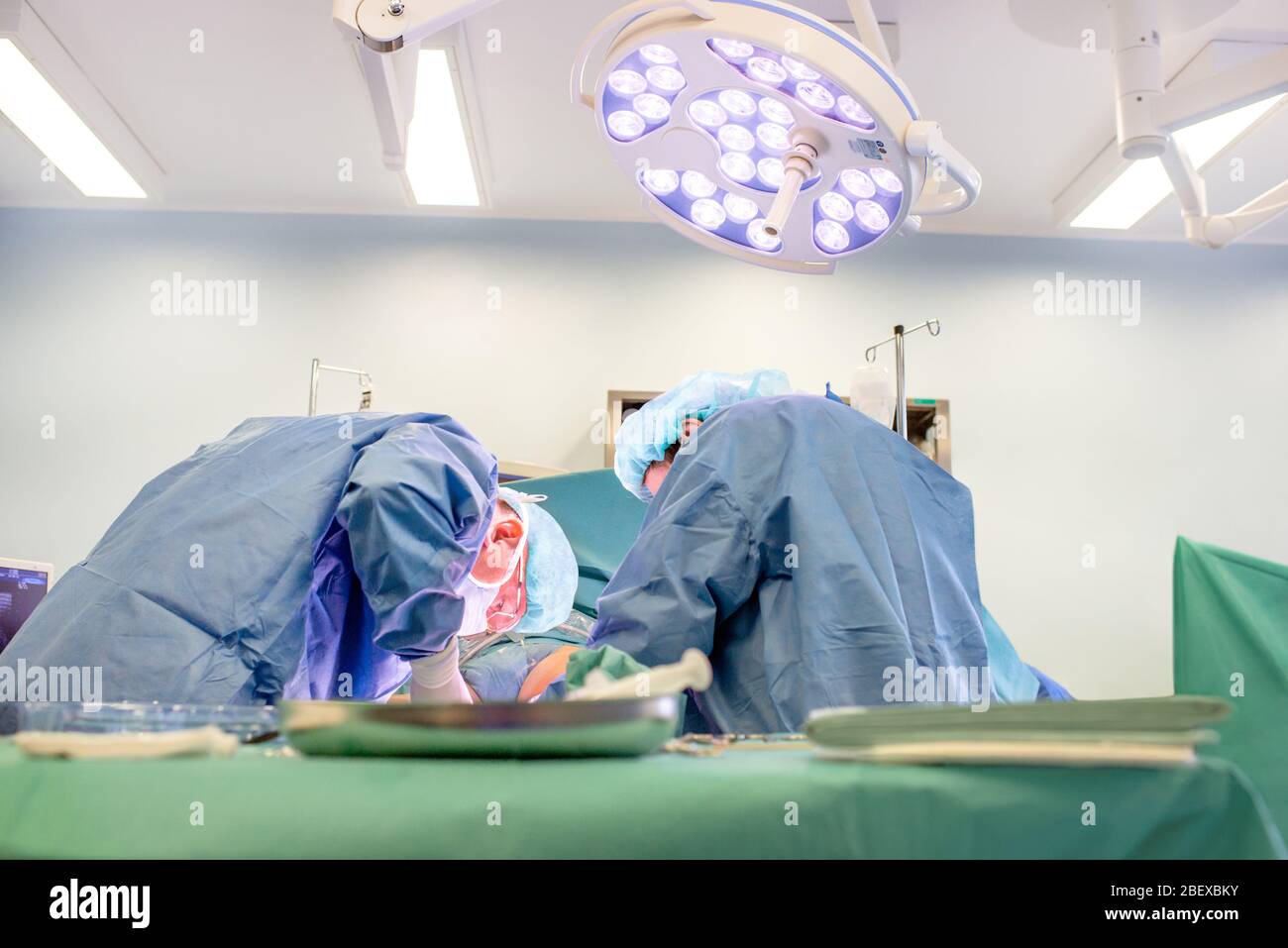 Medical professional in an operating room performing medical procedure ...