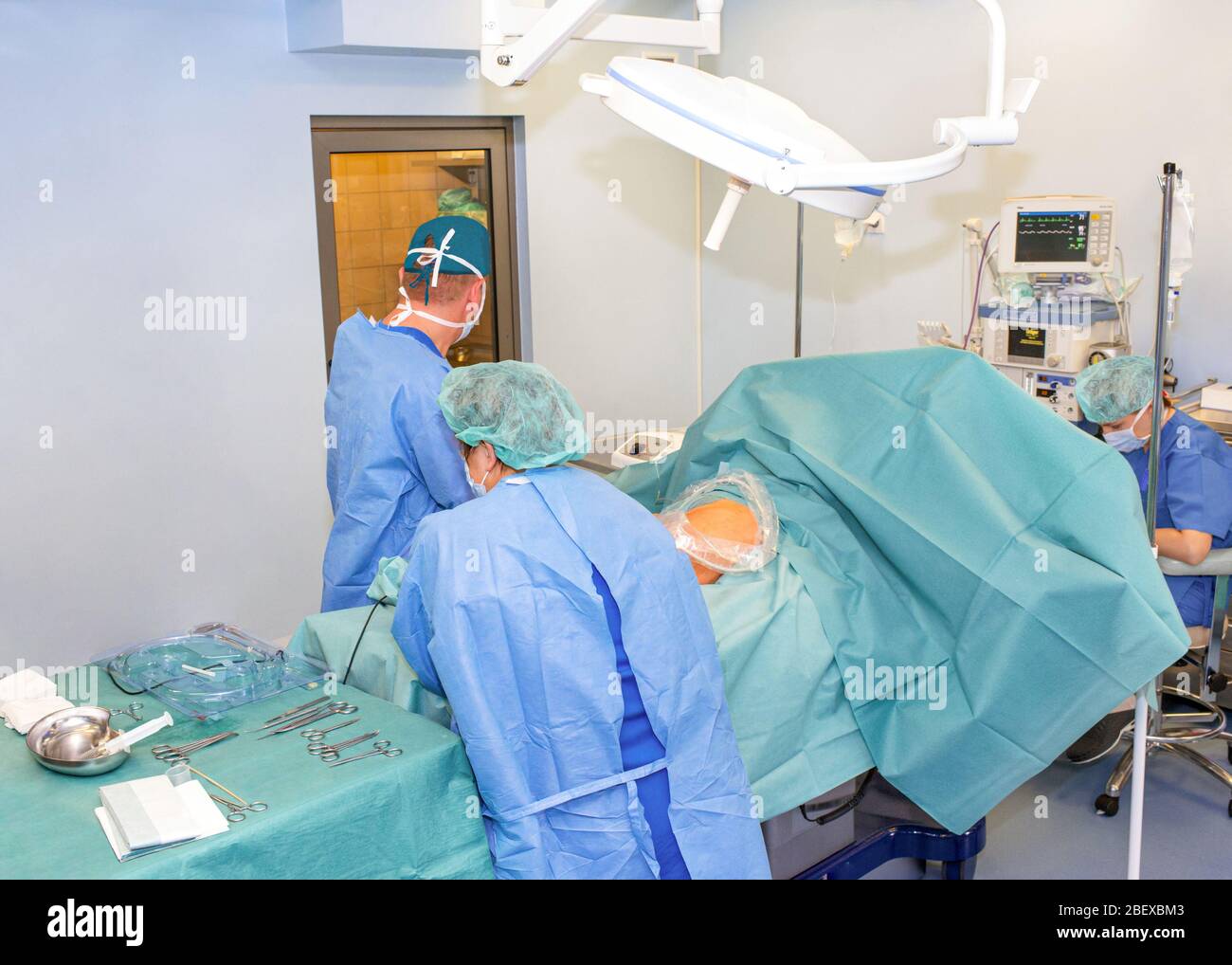 Medical professional in an operating room performing medical procedure ...