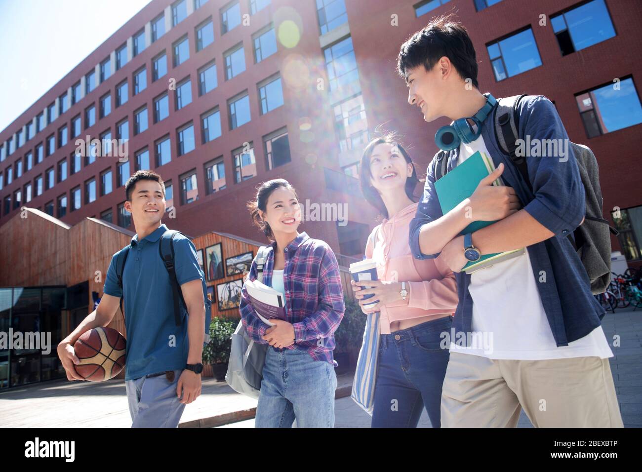 College students on campus walked inside Stock Photo - Alamy