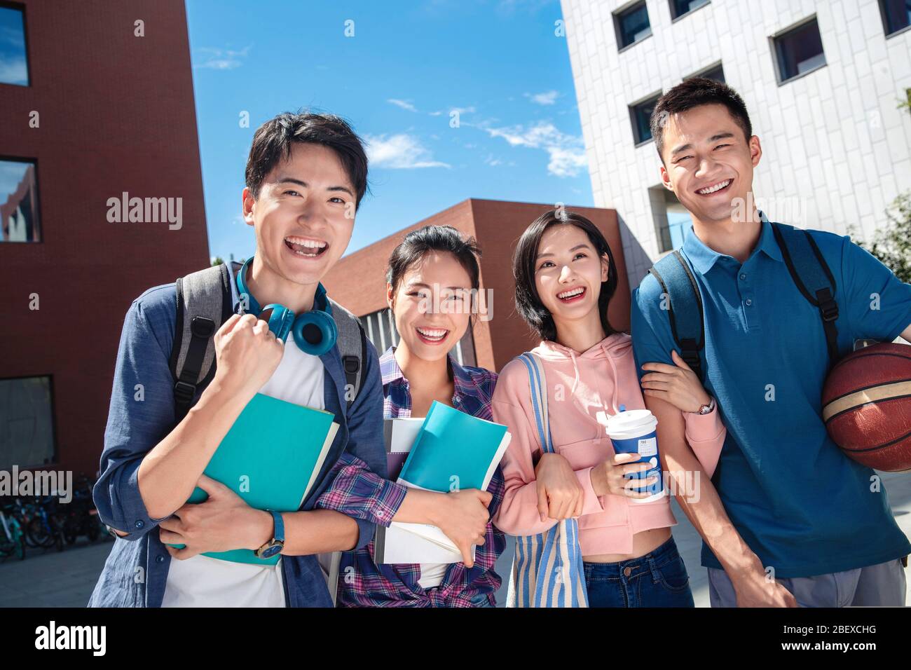 Two pairs of sweet college student couples on the campus Stock Photo ...