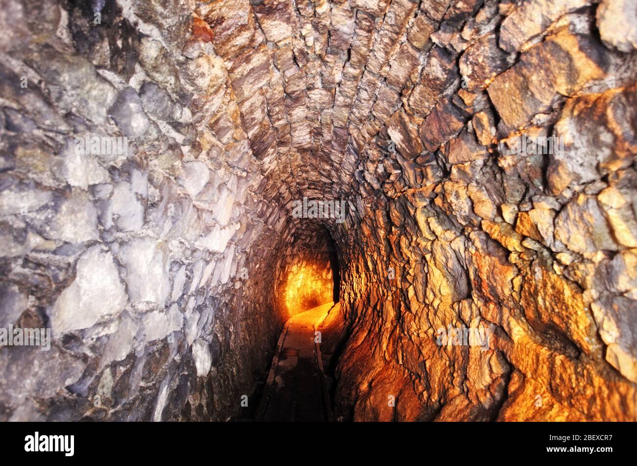 Mine with railroad track - underground mining Stock Photo - Alamy