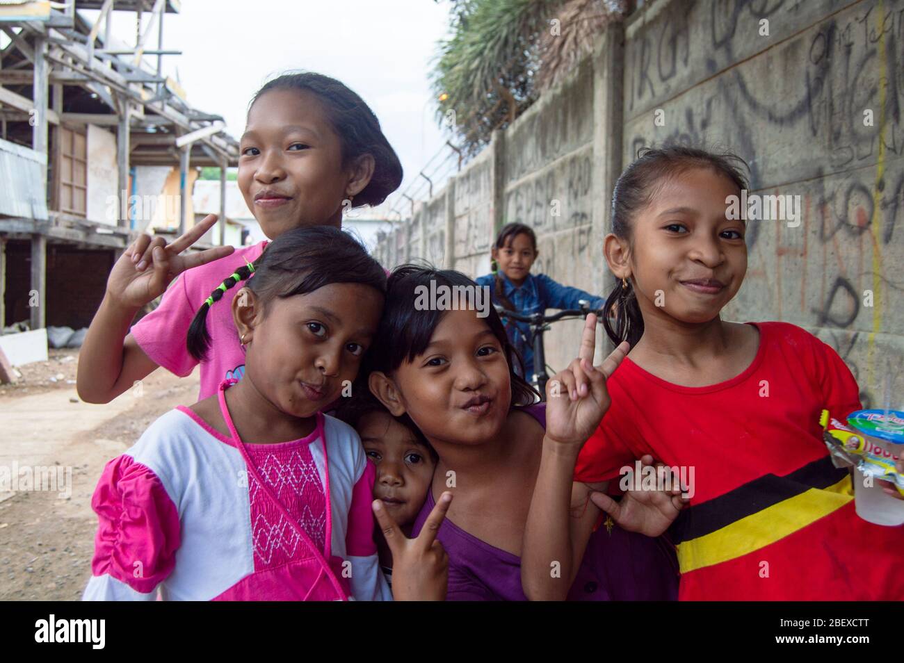 Indonesian Children posing in front of the camera with funny faces ...