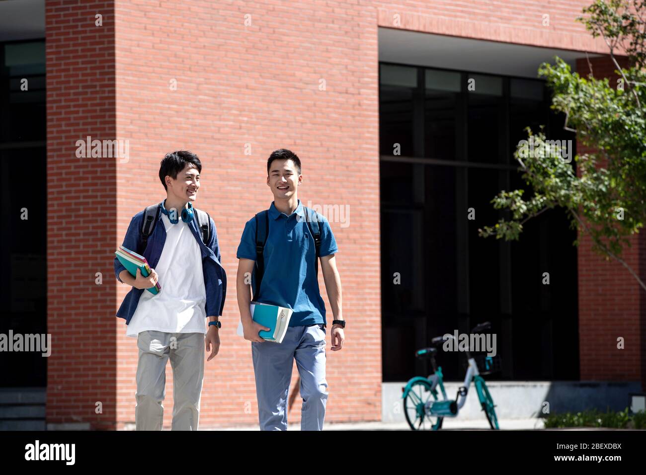 The young man on campus just class is over Stock Photo - Alamy