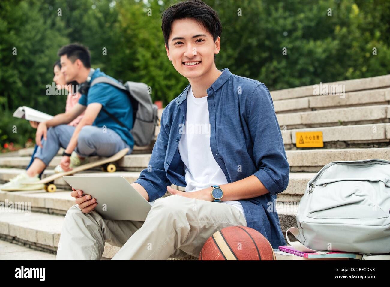 Happy college students sat on the steps of learning Stock Photo - Alamy