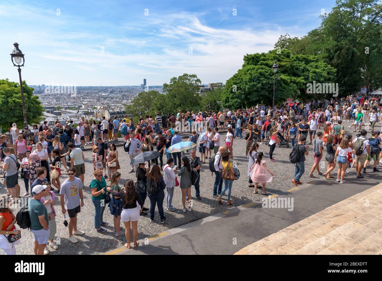 Paris, France. August 2019. Crowds of tourists take pictures and ...