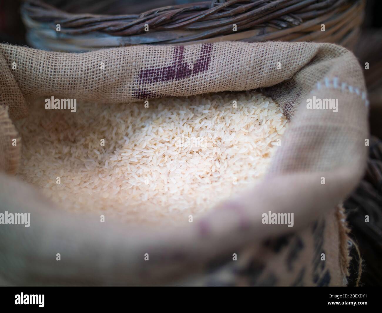 A large burlap sack of rice Stock Photo - Alamy