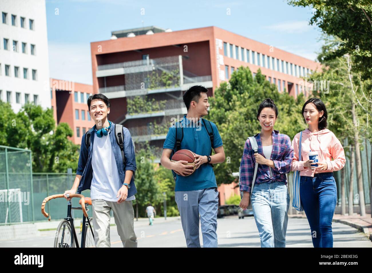 Happiness of college students walking in the campus Stock Photo - Alamy