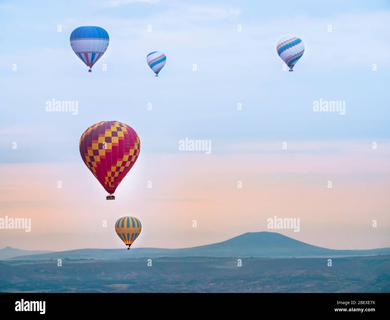 Hot air balloons over mountains hi-res stock photography and images - Alamy