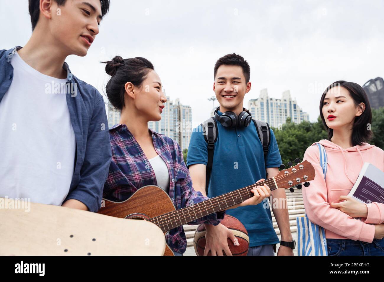 Outdoor happiness of college students play together Stock Photo - Alamy