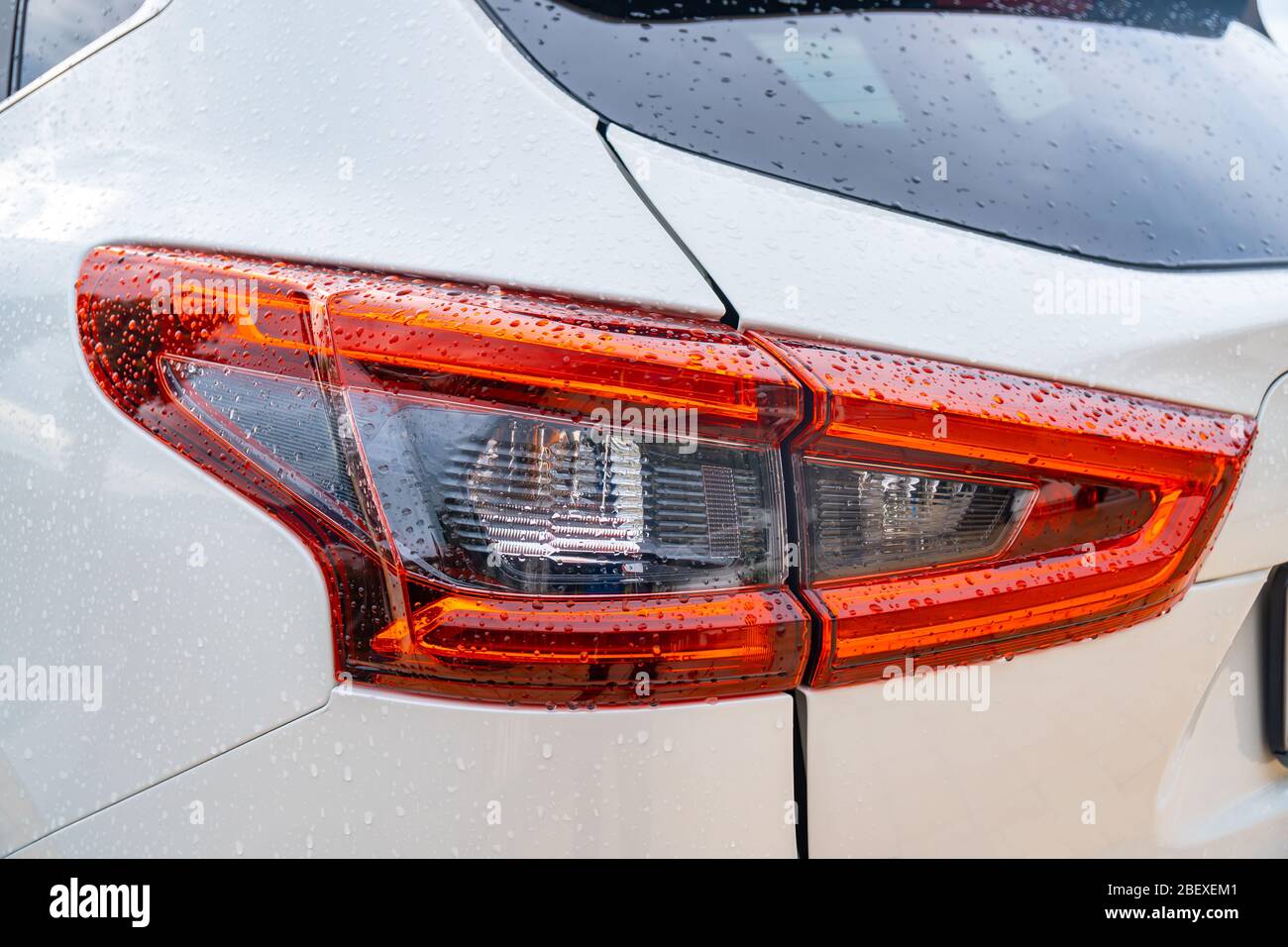 Detail of rear light on a modern white car Stock Photo - Alamy