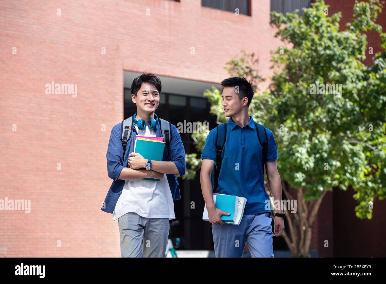 The young man on campus just class is over Stock Photo - Alamy