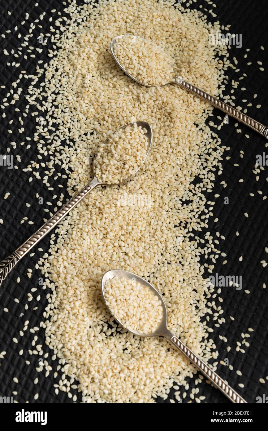 Close up view of dry sesame seeds. Natural oil-rich food Stock Photo ...