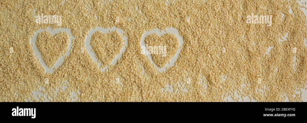 Close up view of dry sesame seeds on white background. Natural oil-rich ...