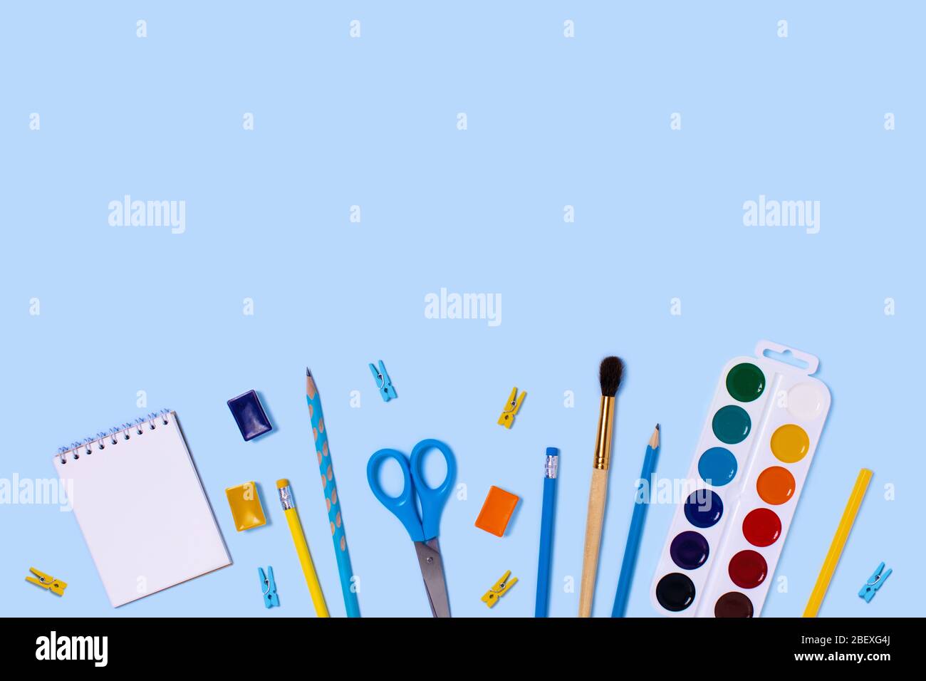 School supplies on blue background. Back to school flat lay picture ...