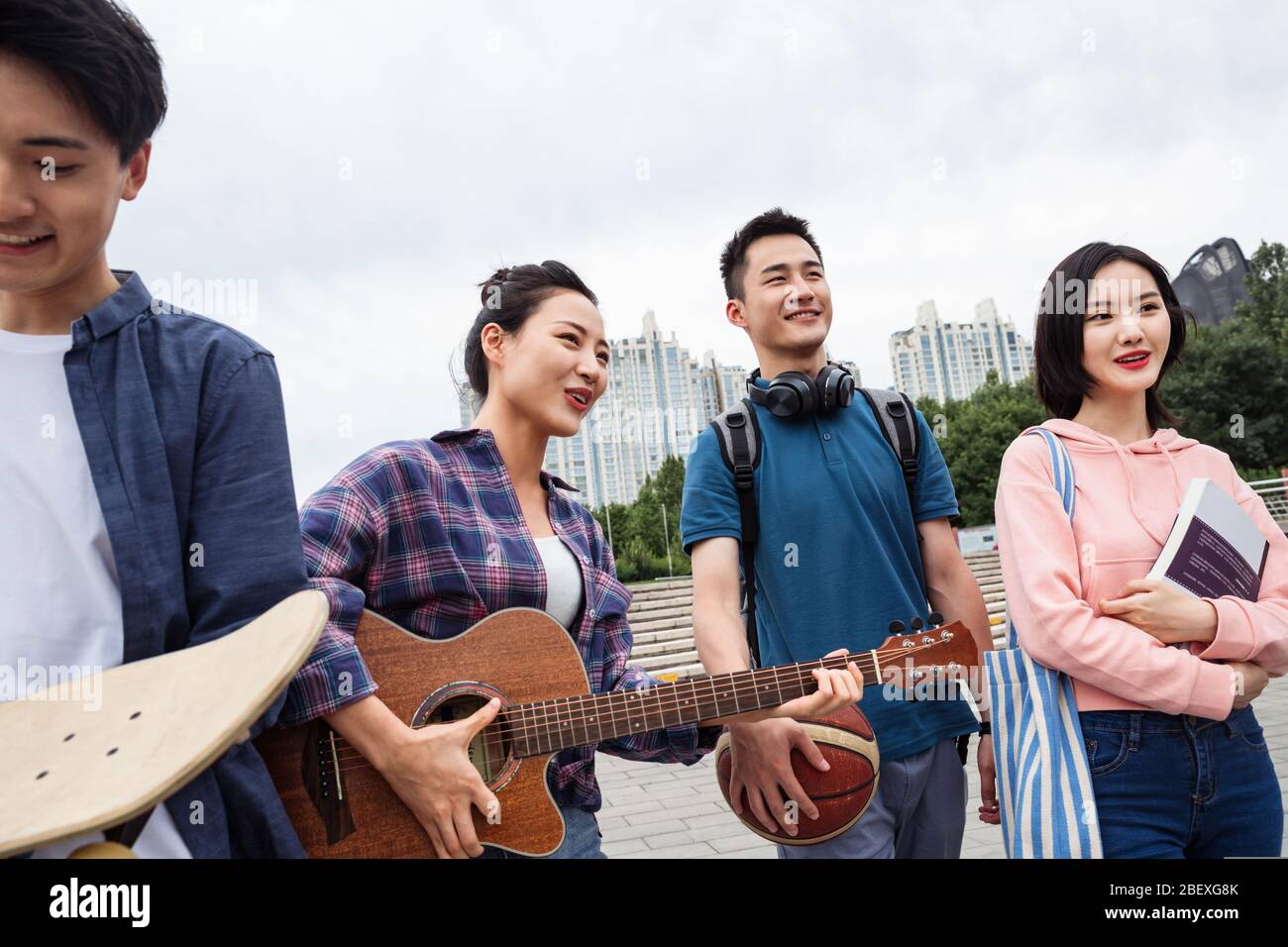Outdoor happiness of college students play together Stock Photo - Alamy