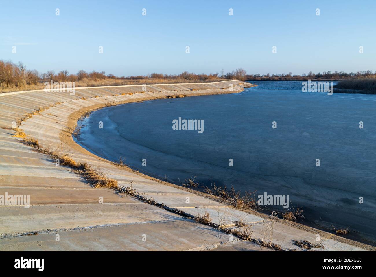 Bank of river made of concrete blocks Stock Photo - Alamy