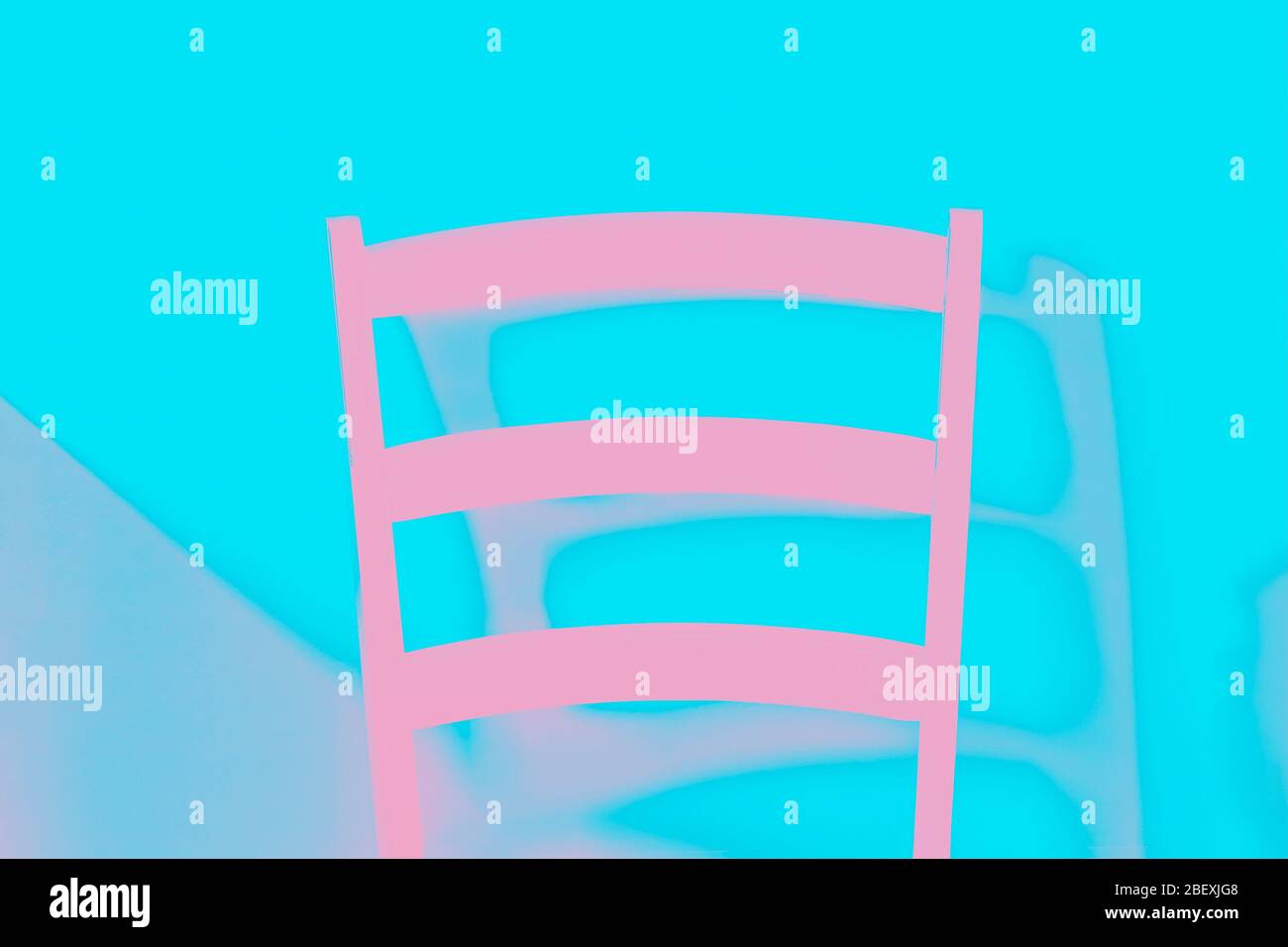 Pink neon chair on aquamarine color wall background. The back of the ...