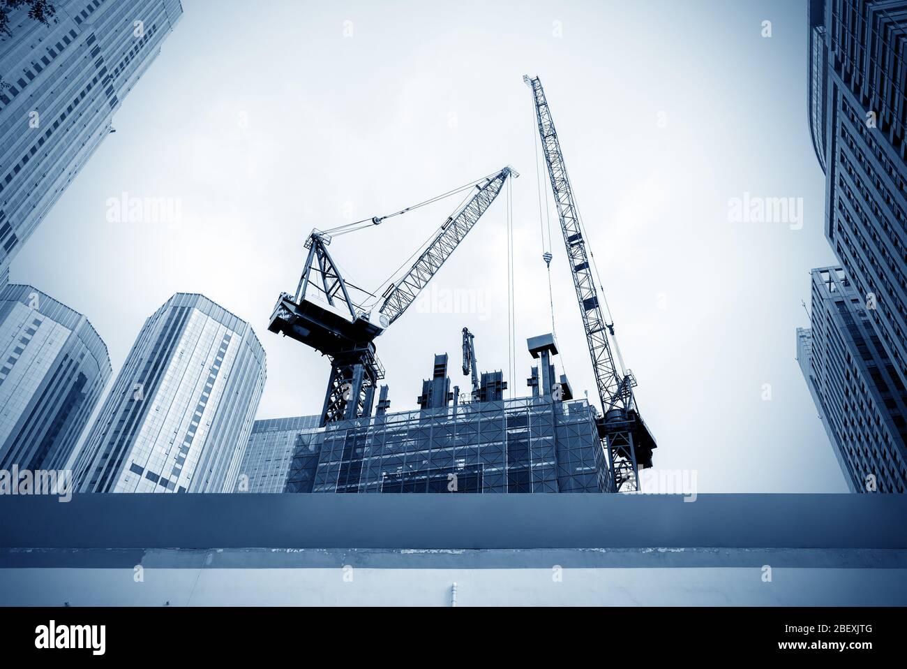 Building construction site, tall skyscrapers and cranes Stock Photo - Alamy