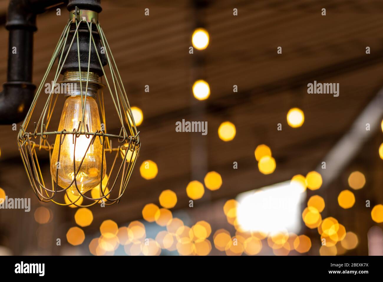 Modern lamp from metal with Edison bulb in outside restaurant cafe ...