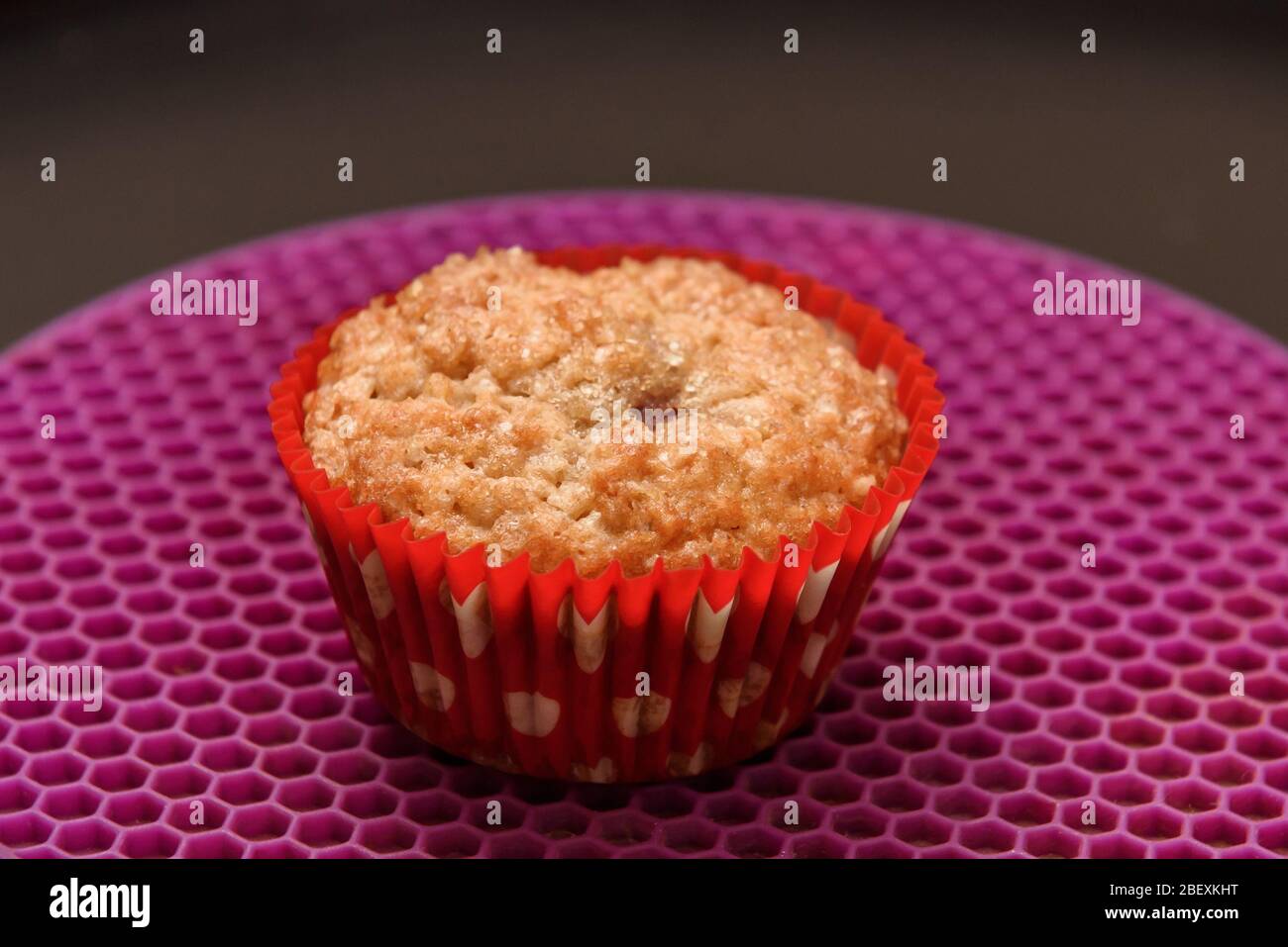 Home baked muffin at red paper form hi-res stock photography and images ...