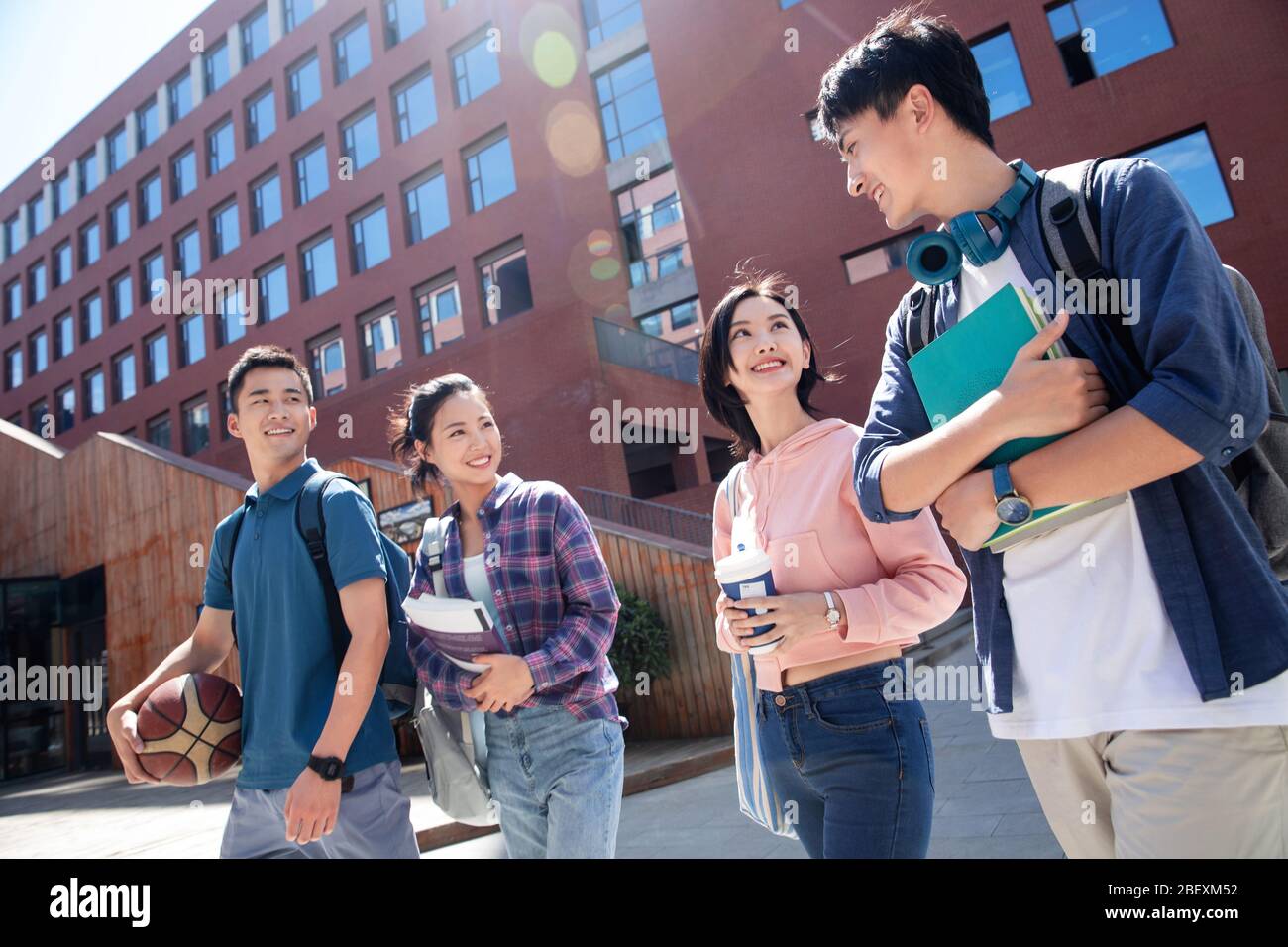 The sun two couples on the campus of university students Stock Photo ...