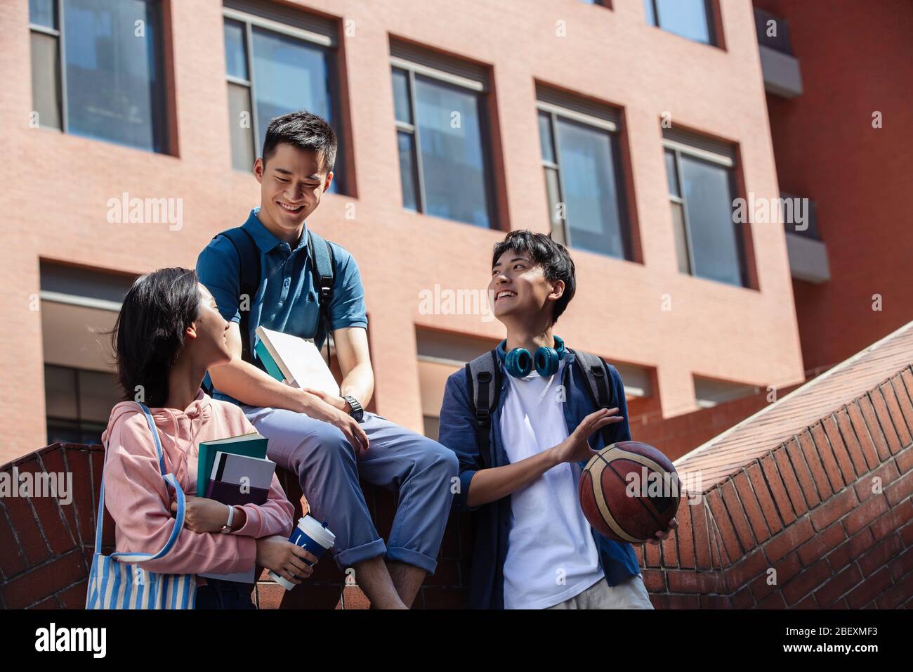 The first class of college students on campus gossip Stock Photo - Alamy