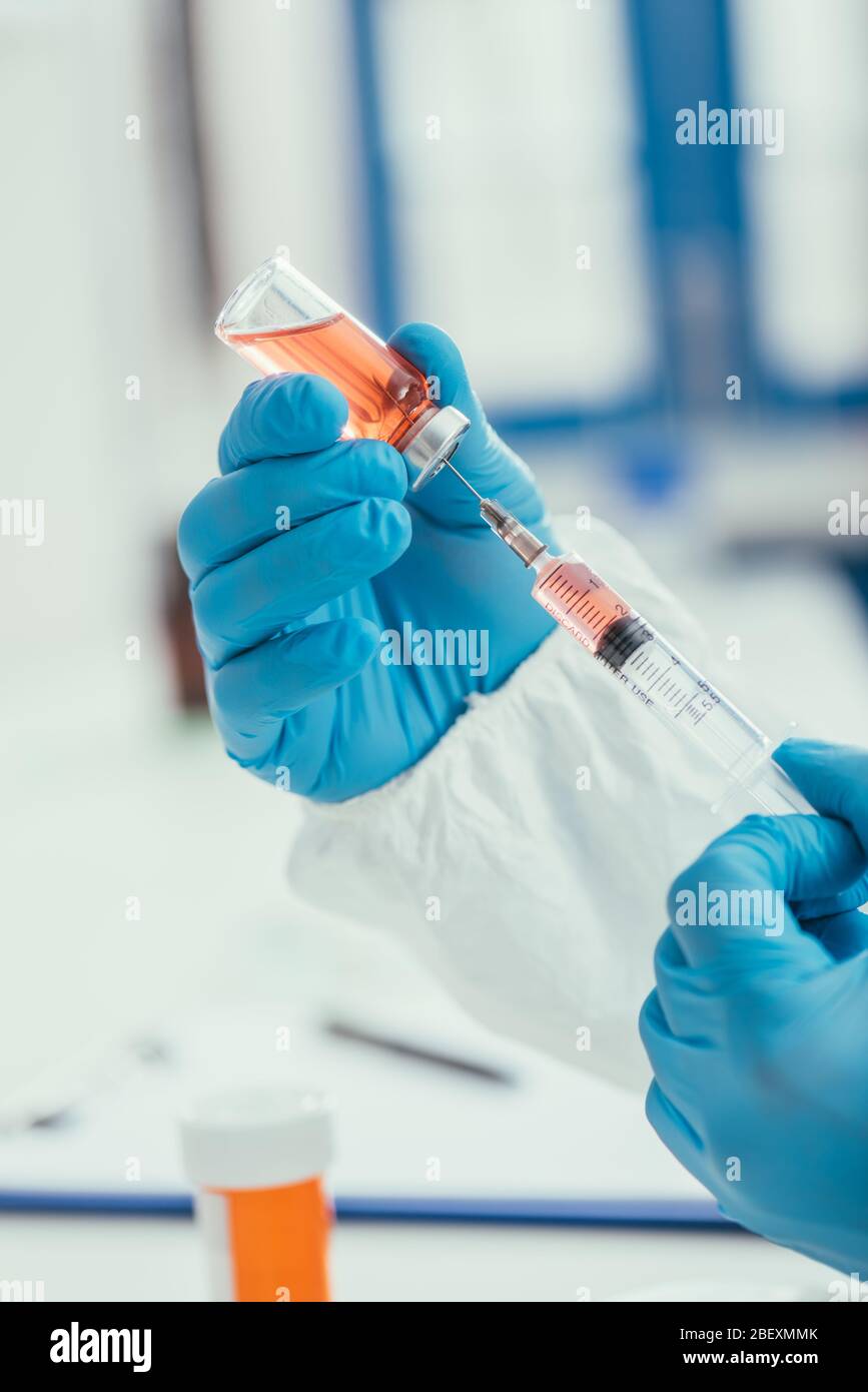 Cropped view person taking syringe hi-res stock photography and images ...
