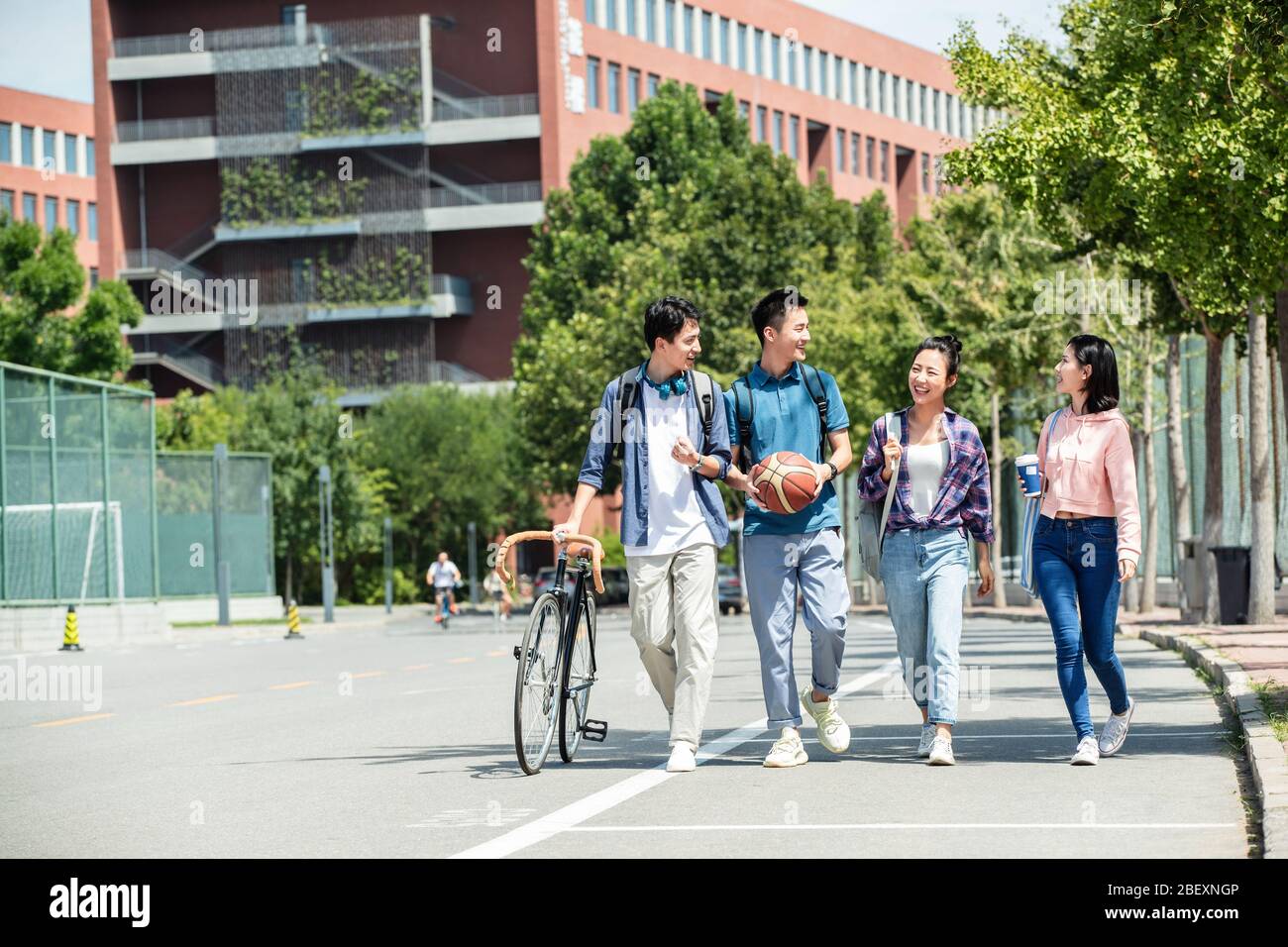 Happiness of college students walking in the campus Stock Photo - Alamy