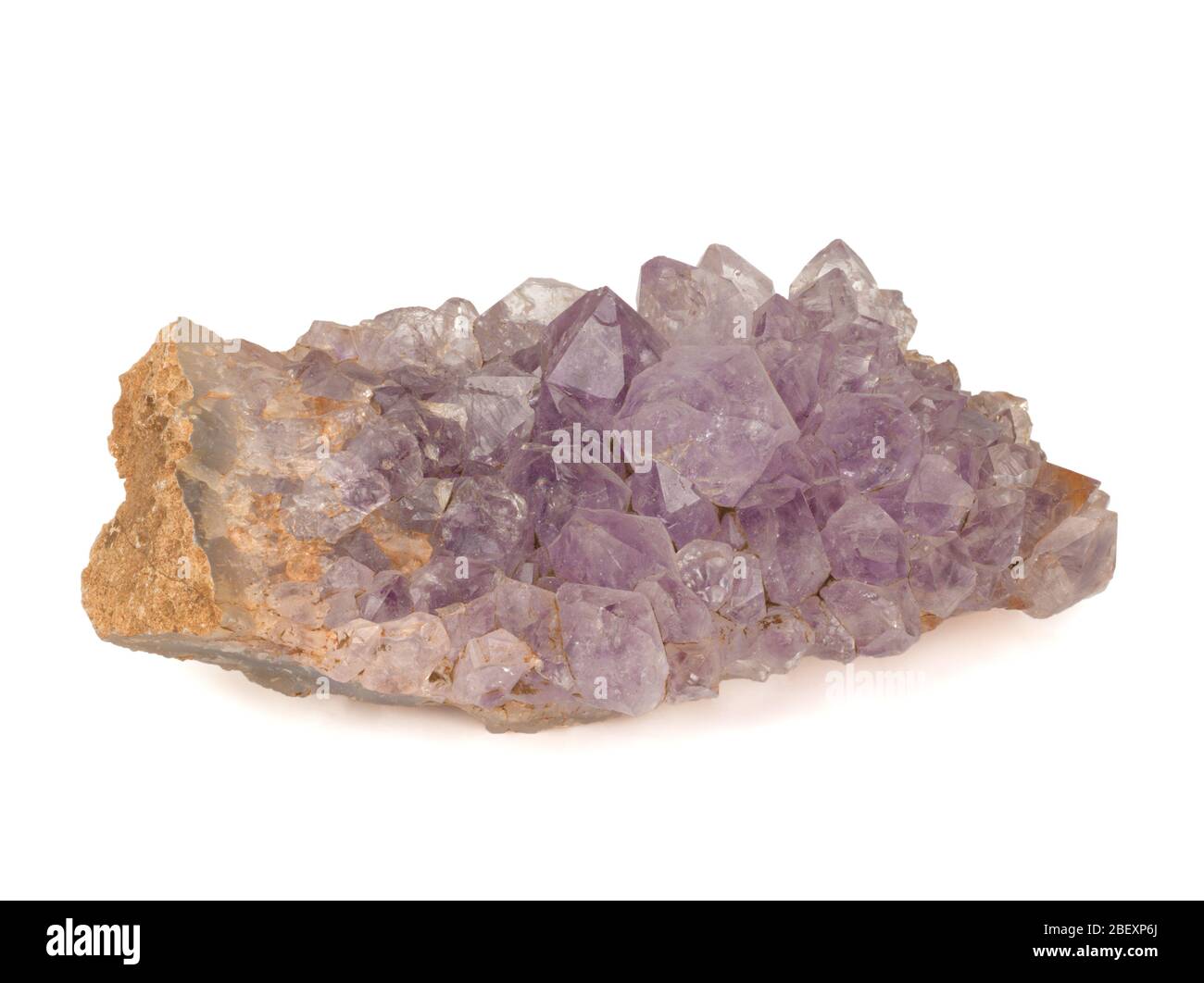 Amethyst crystals close-up on white background Stock Photo - Alamy