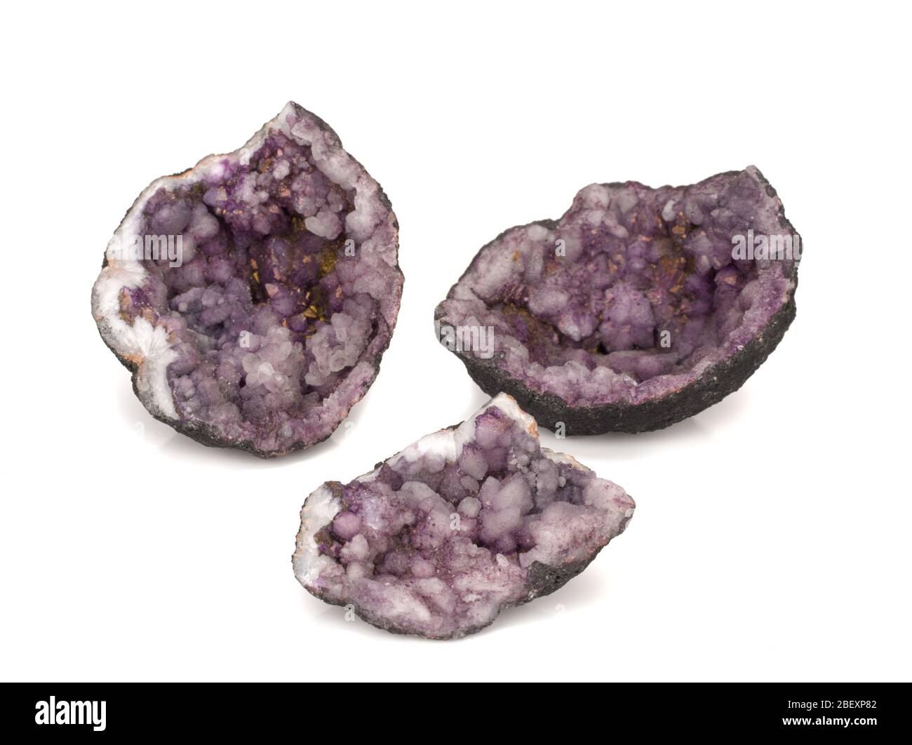 Amethyst crystals close-up on white background Stock Photo - Alamy